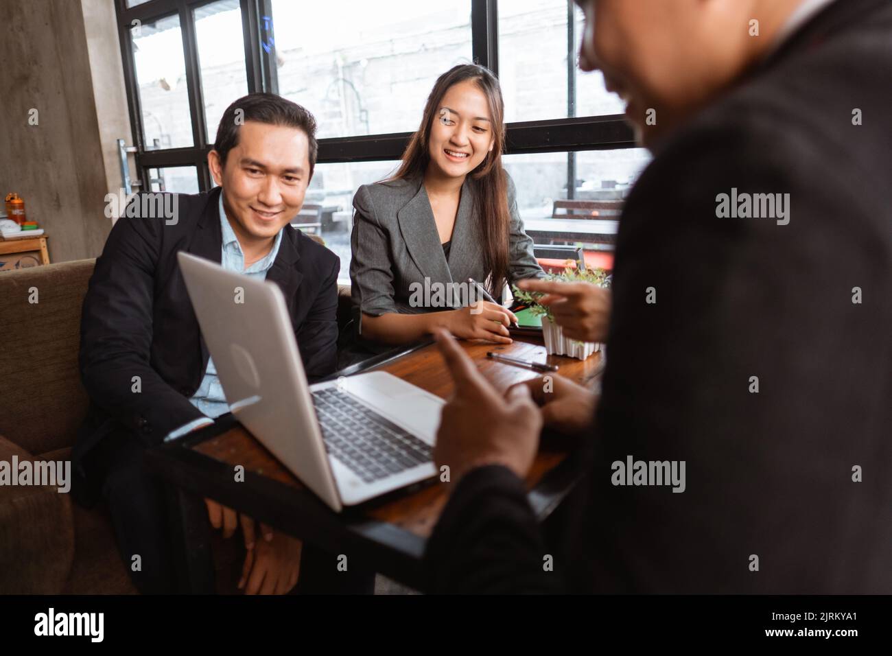 business people presentation when having a meeting in cafe Stock Photo - Alamy