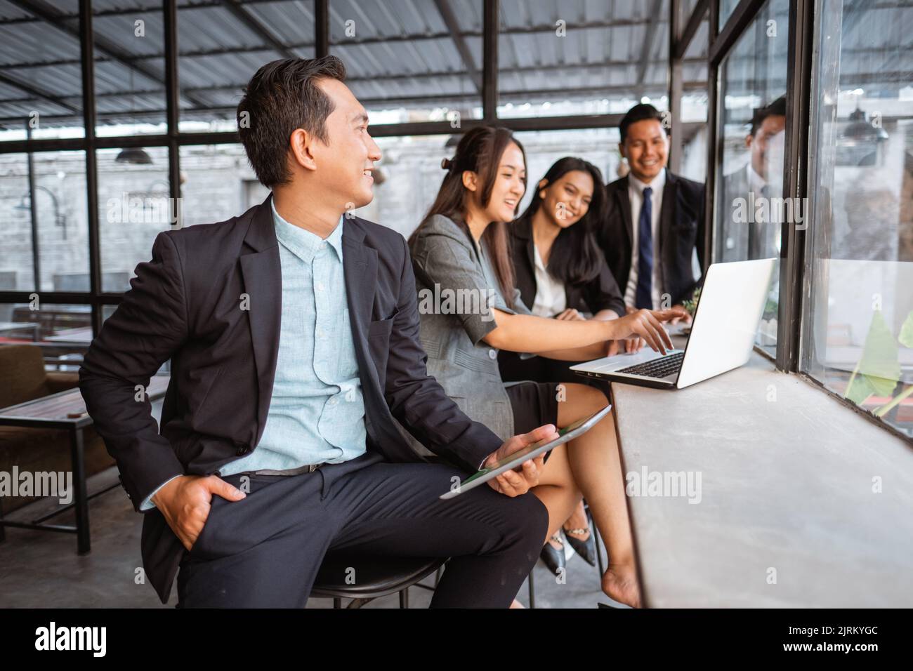 business people meeting in cafe with partner and colleagues near window ...