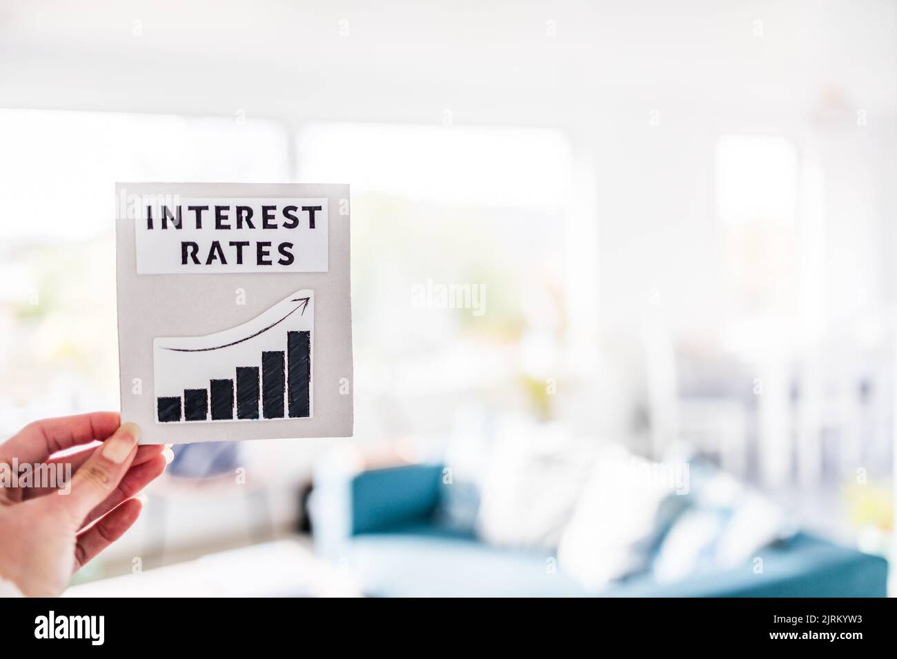 property affordabilikty and home loan payment increases, hand holding ...