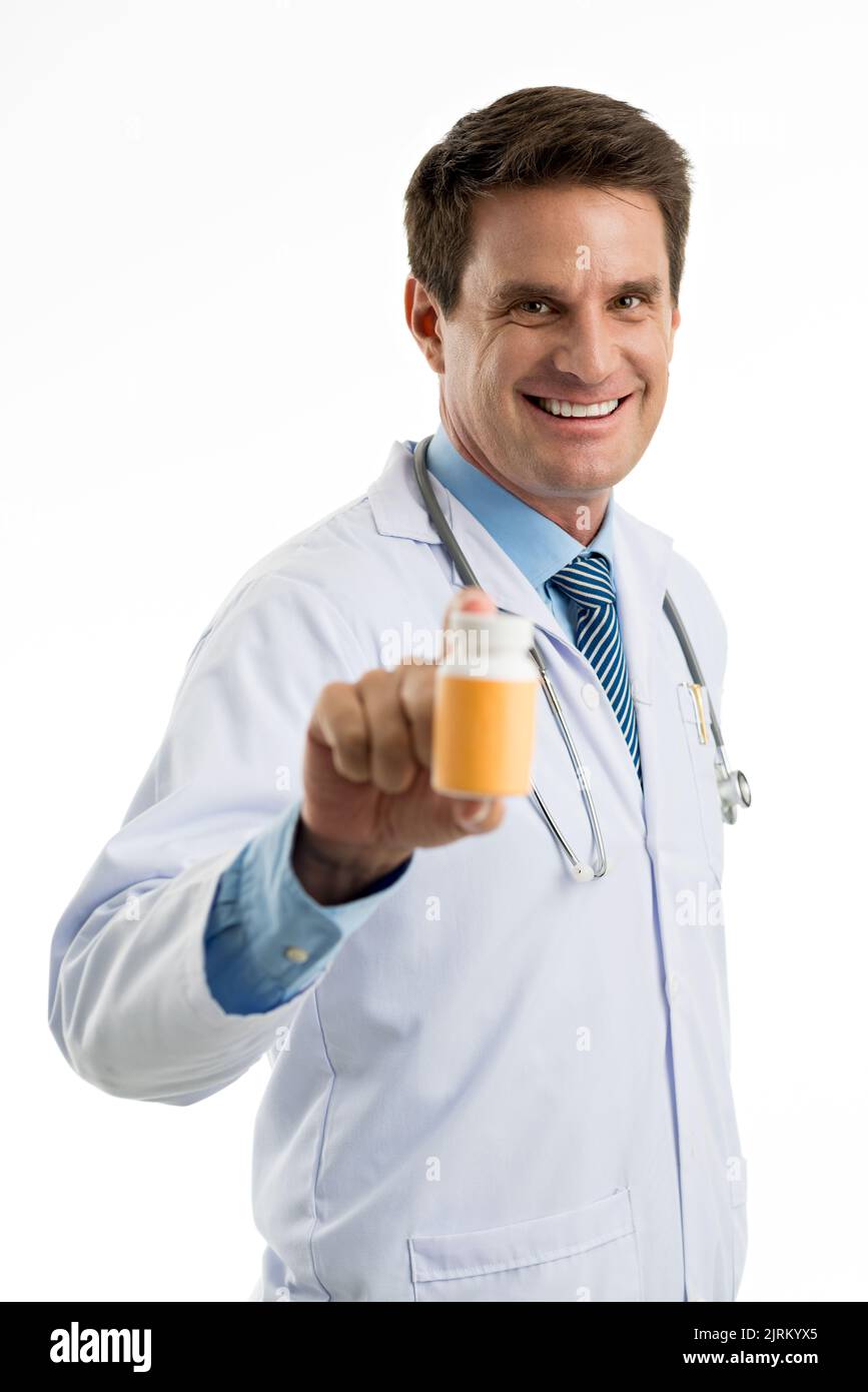 Smiling handsome family doctor giving vitamins to patient Stock Photo ...