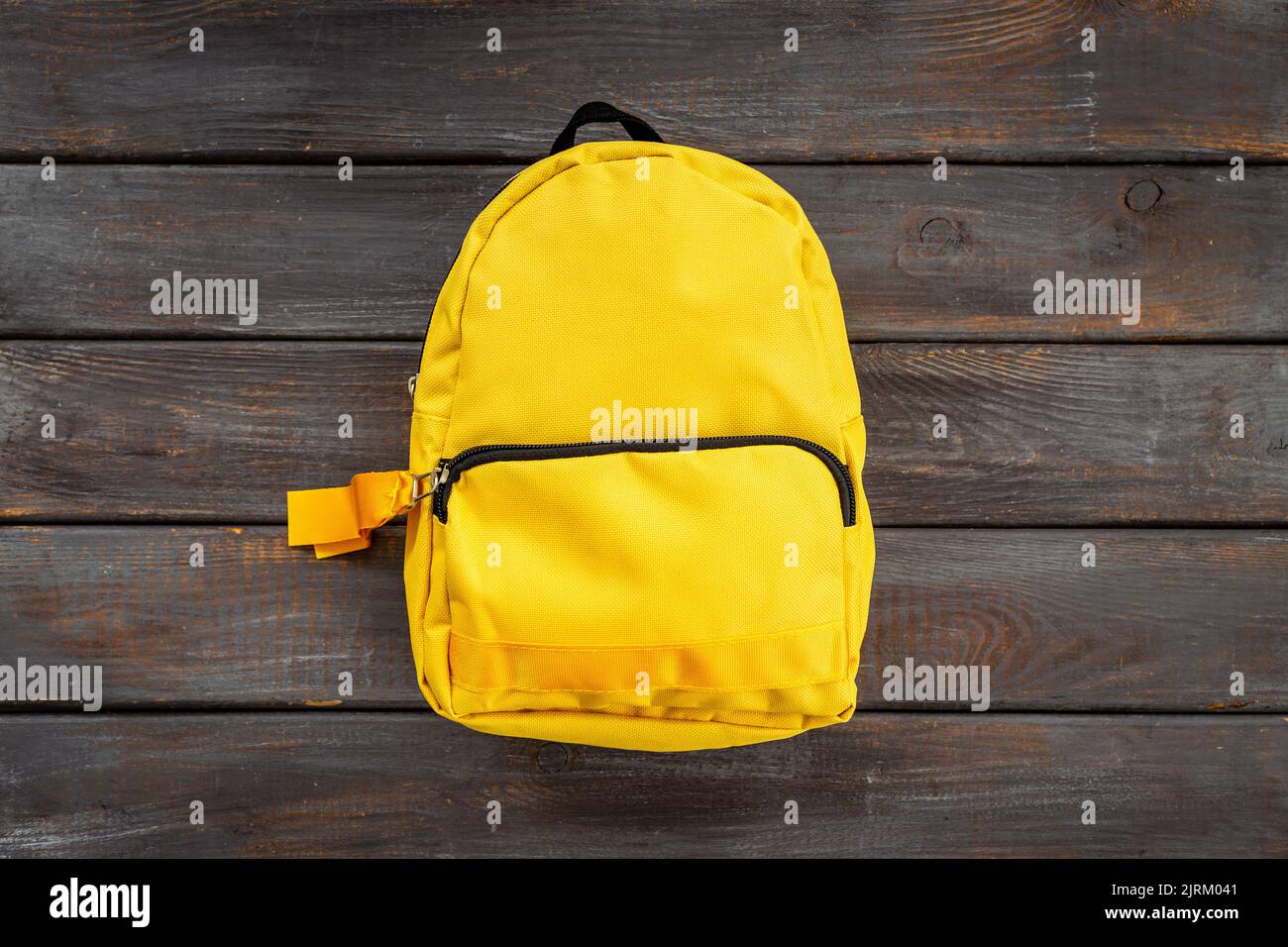 Yellow school backpack. Back to school concept. Top view Stock Photo ...
