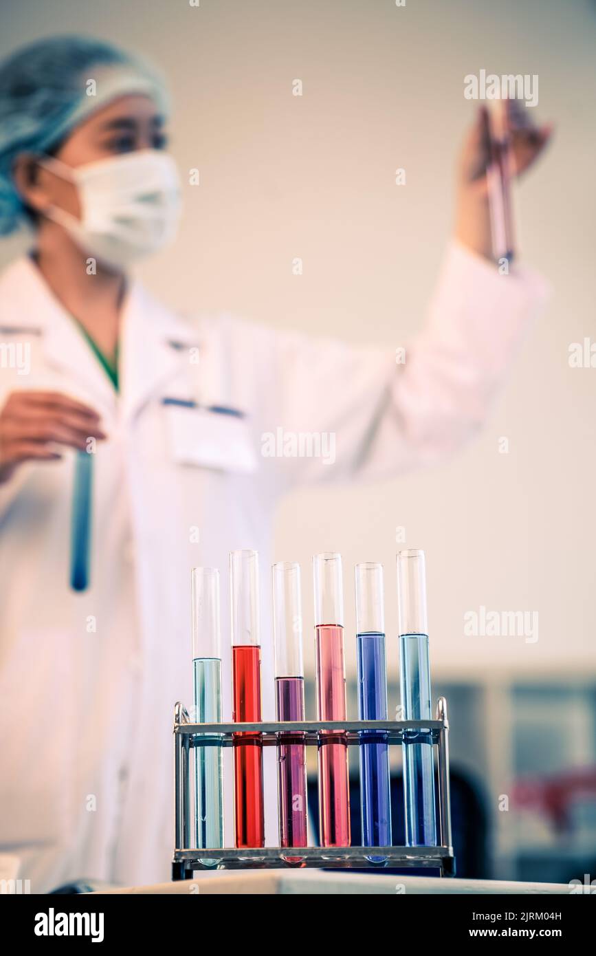 Laboratry worker analyzing various liquids in test-tubes Stock Photo ...