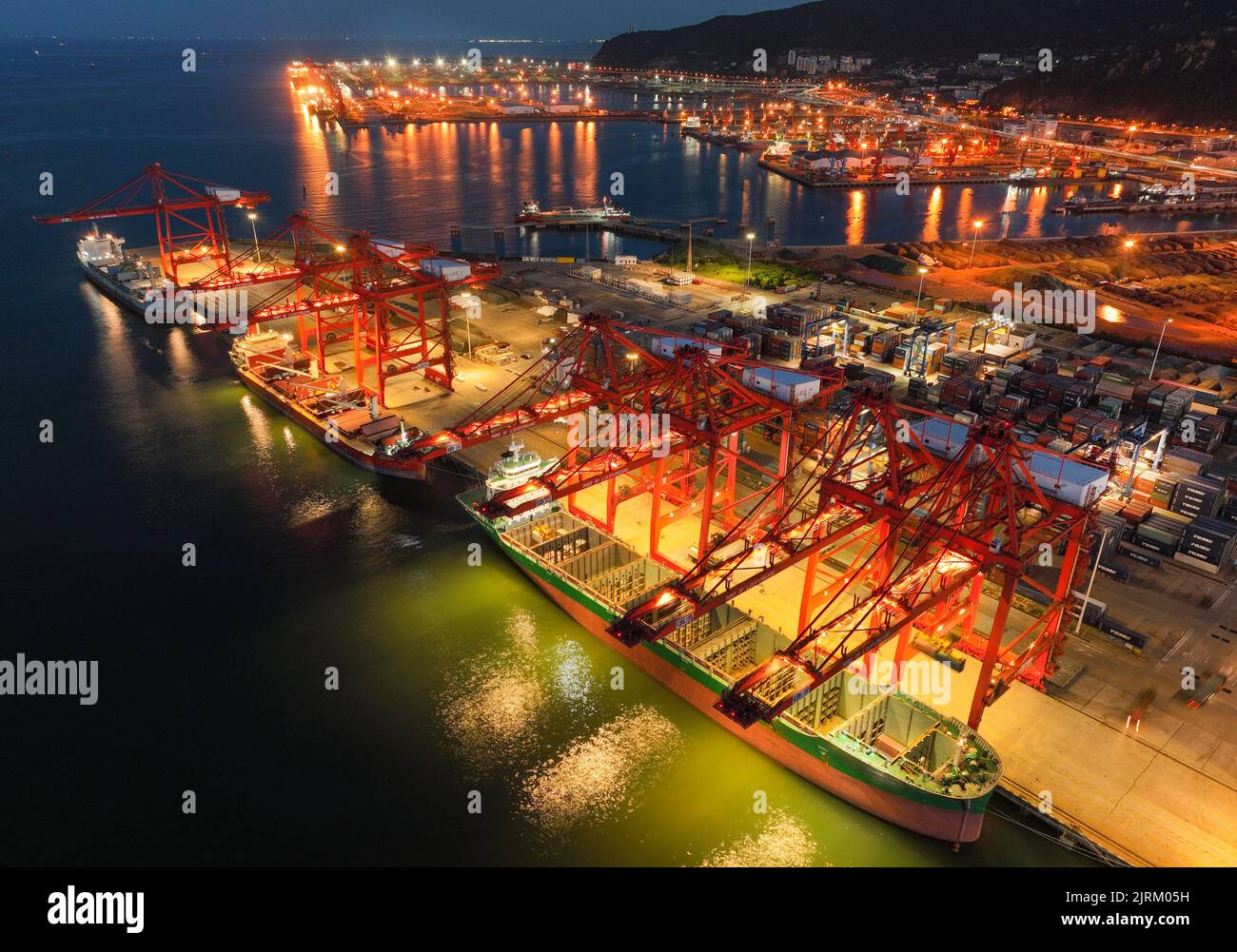 LIANYUNGANG, CHINA - AUGUST 24, 2022 - Large machines load and unload ...