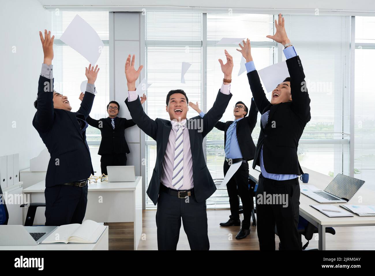Men celebrating in suits hi-res stock photography and images - Alamy