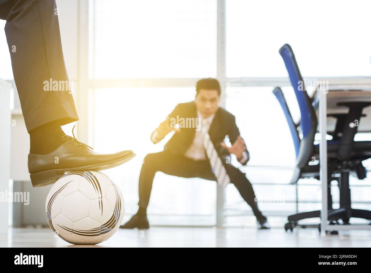 Taking short break from work: two white collar workers having fun ...