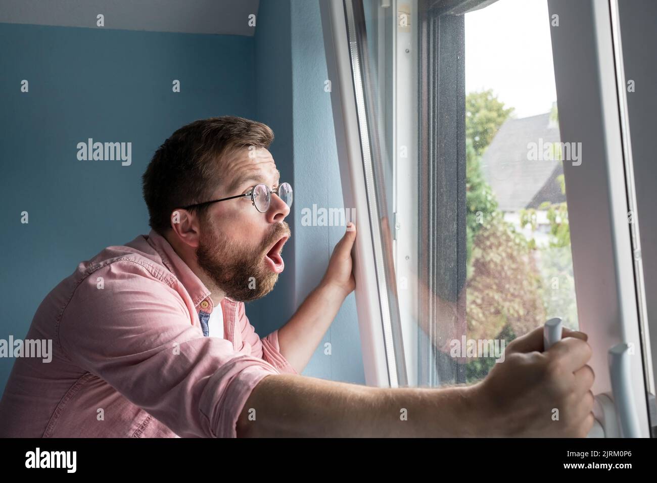 Man Looking Through A Window