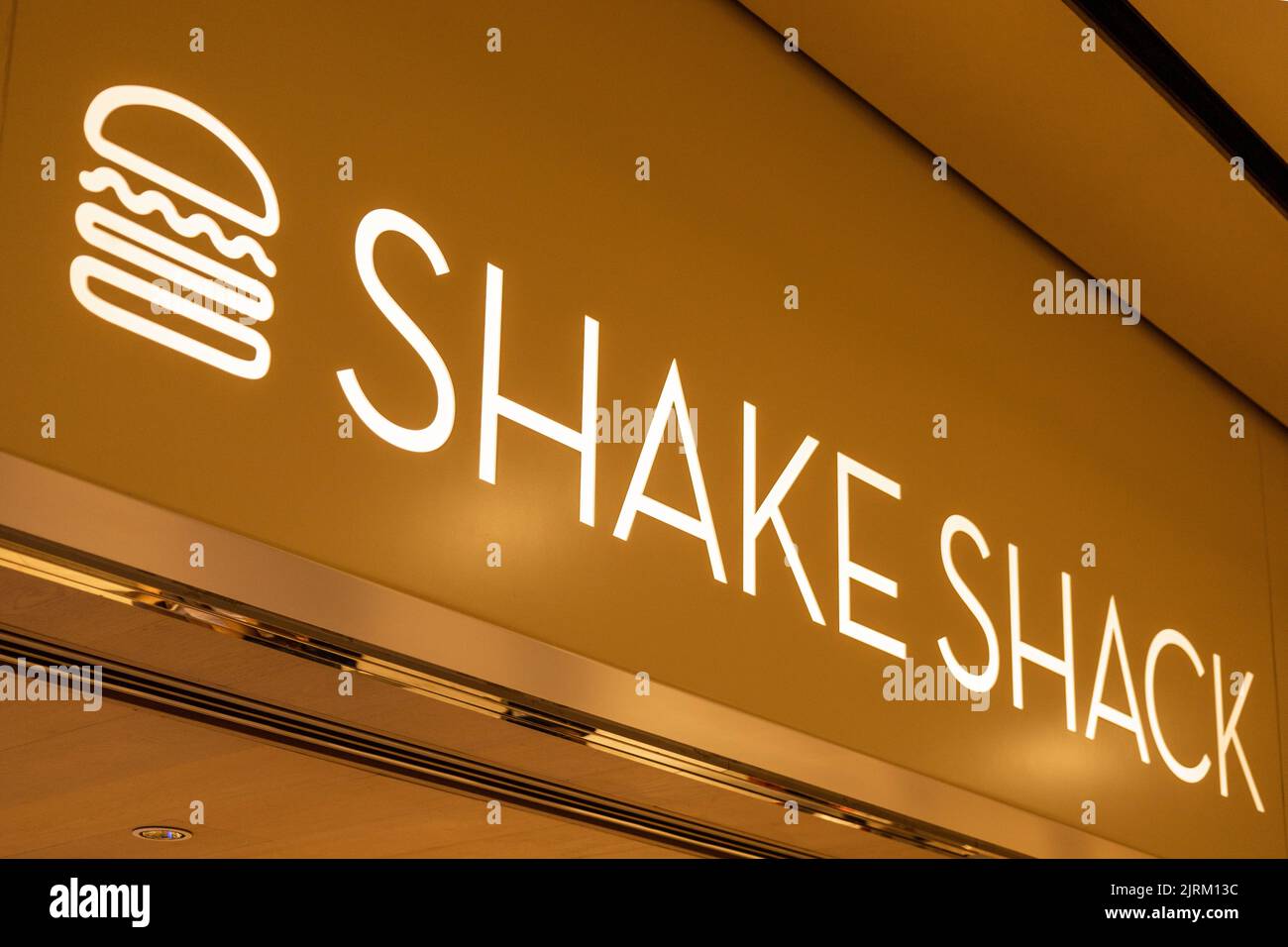 A closeup shot of the Shake Shack logo at a shopping mall in Hong Kong ...