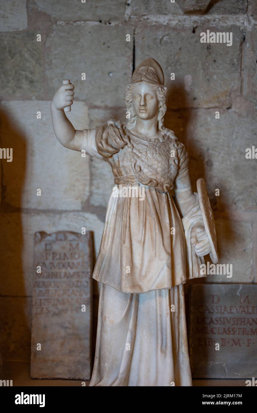 A vertical shot of the statue of Greek god Athena in the Bellver Castle ...