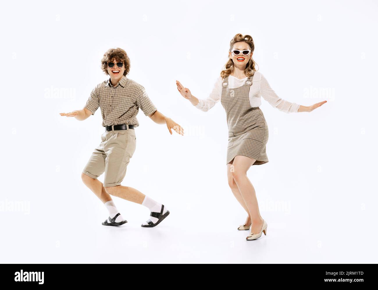 Expressive couple of dancers in vintage retro style outfits dancing ...