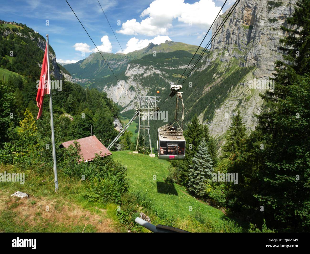 A cable car from Stechelberg approaches Gimmelwald, Murren, Bernese ...