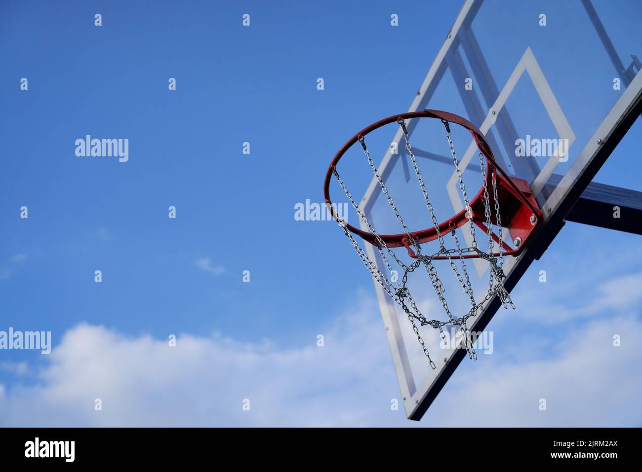 Empty ring of basketballs in the park against the blue sky. Street ...