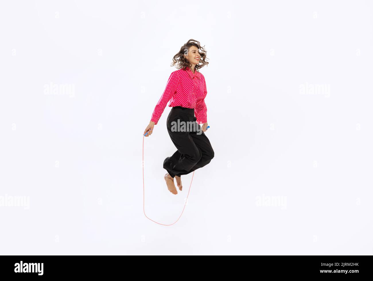 Young happy beautiful woman in retro, 70s, 80s fashion style clothes ...