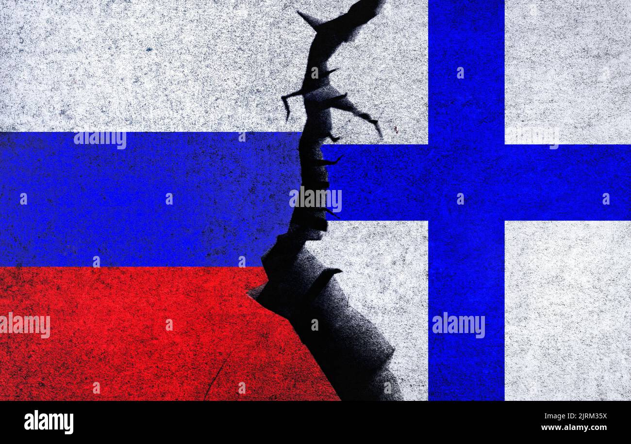 Russia vs Finland concept flags on a wall with a crack. Finland and ...