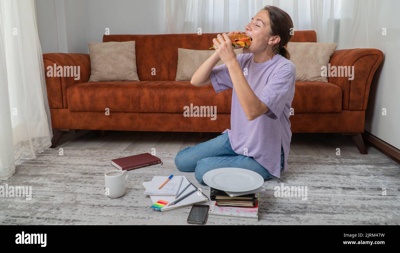 Female Student Eats Sandwich During Classes at Home - Online Education ...