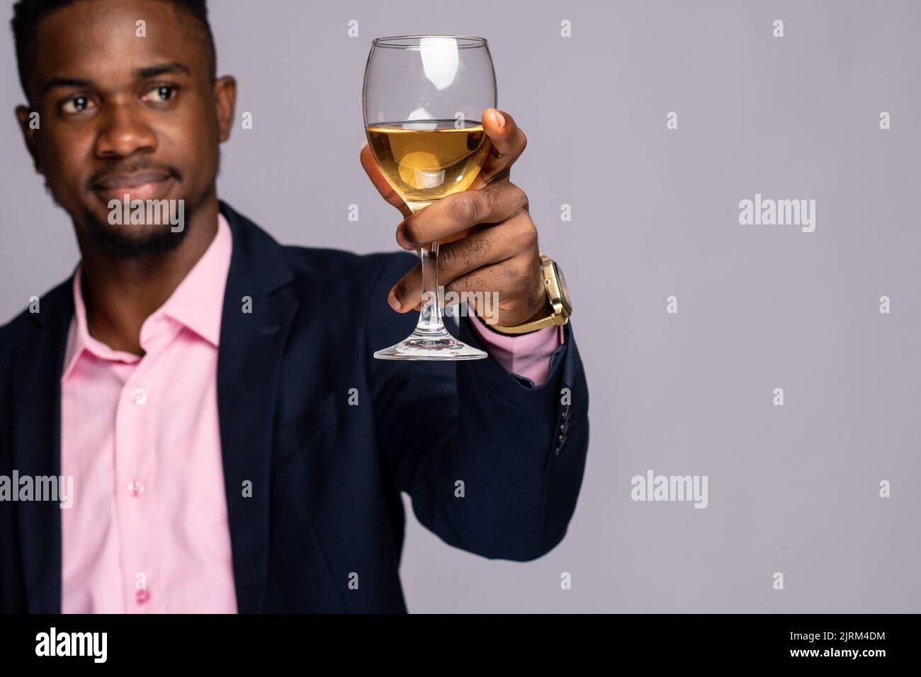 Hand raising a glass hi-res stock photography and images - Alamy