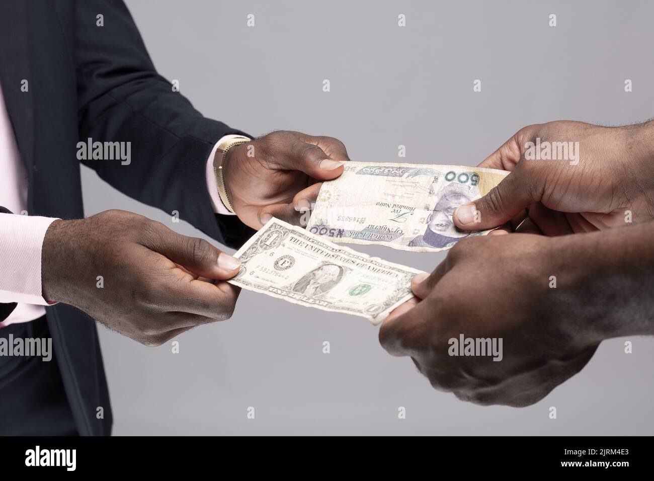 people exchange naira and dollar Stock Photo - Alamy