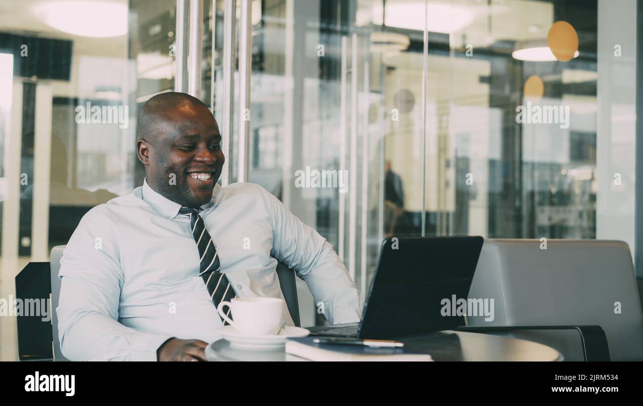 Portrait of hilarious African American businessman in formal clothes ...