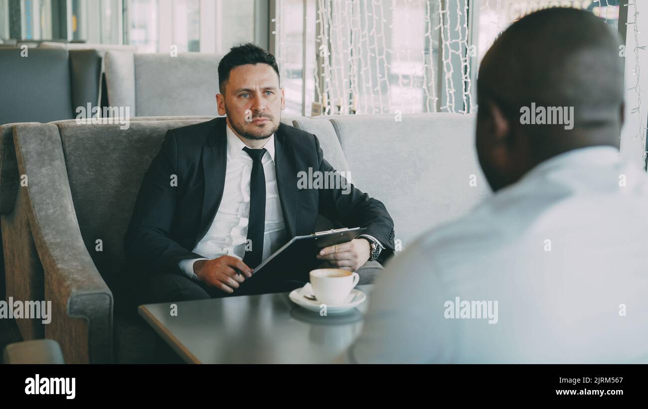 Two person interviewing ethnic hi-res stock photography and images - Alamy