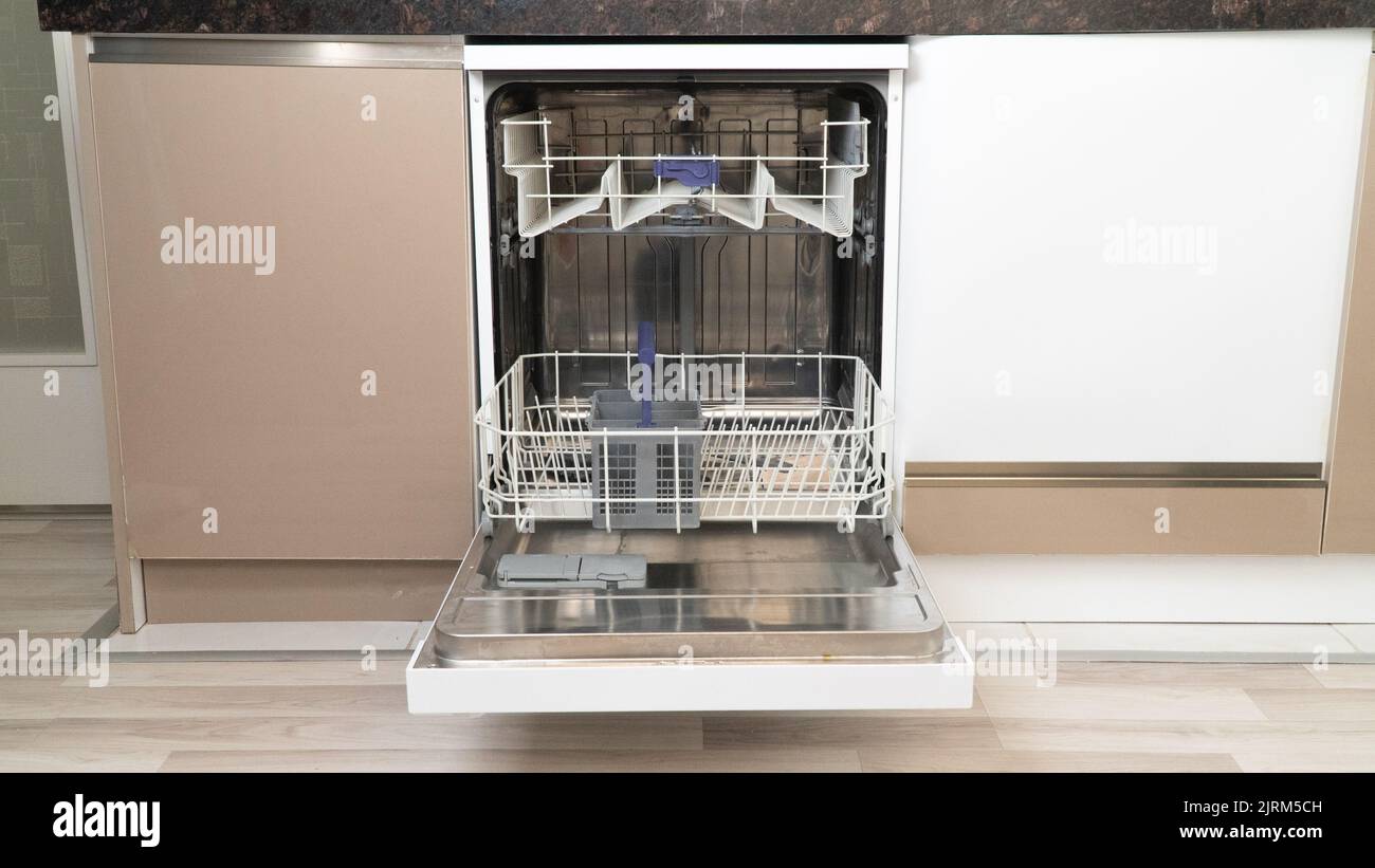 Open empty dishwasher with extended bottom shelf Stock Photo - Alamy