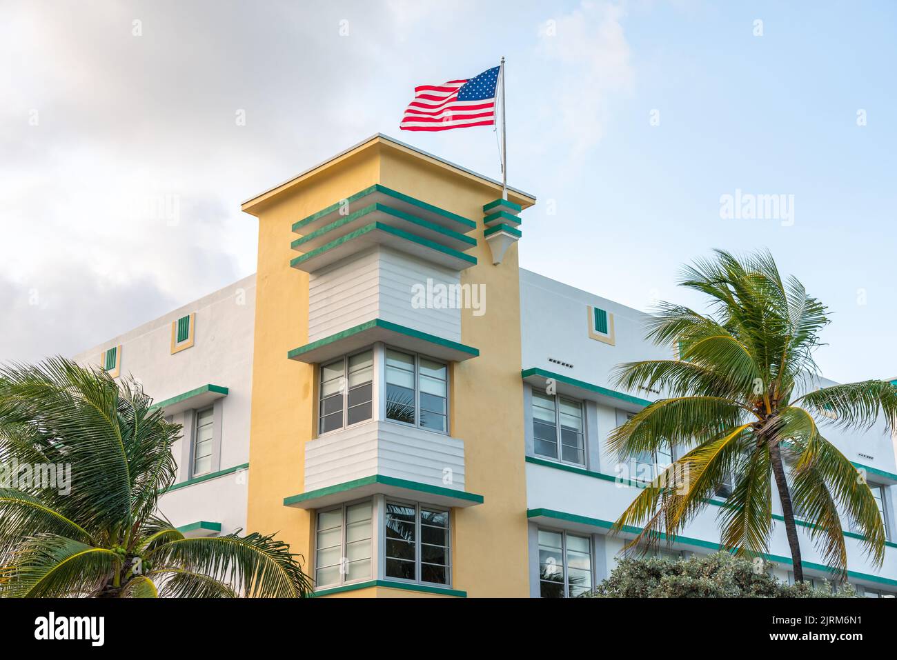 Closeup of typical colorful Art Deco architecture with tropical palm ...