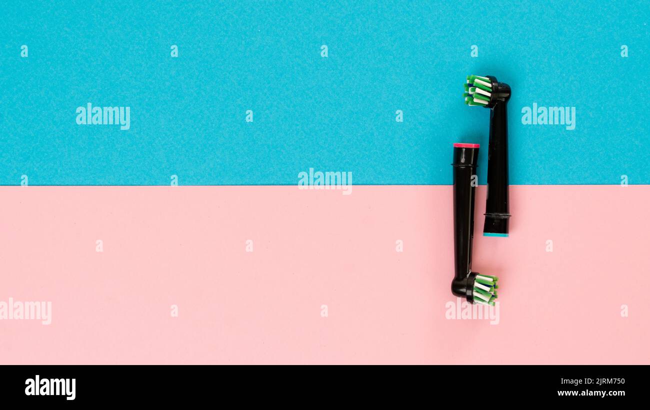 Electric toothbrush attachments on a two-tone background Stock Photo ...