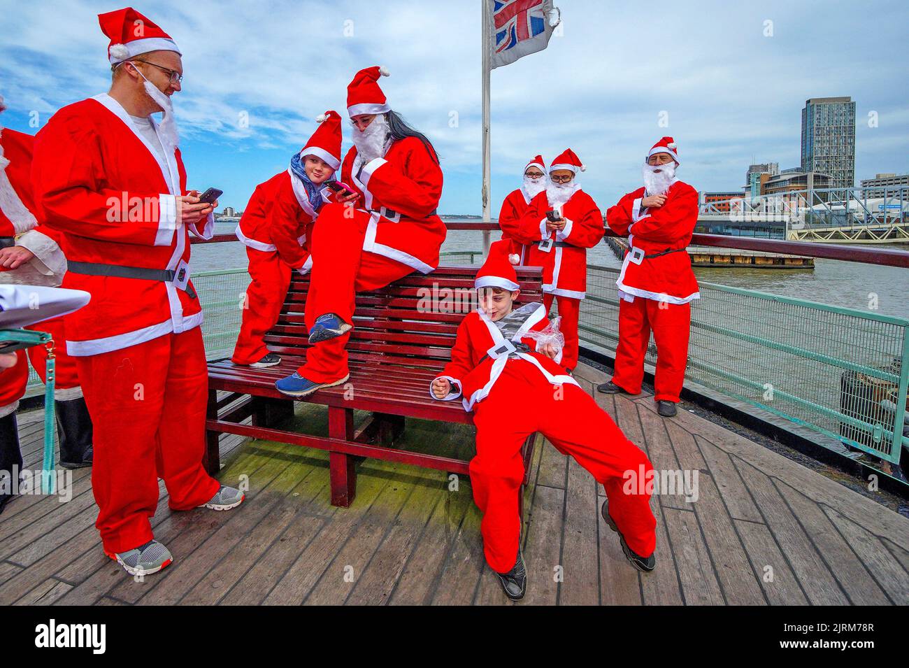 People dressed as Santa Claus on a Mersey Ferry during a photo call for ...
