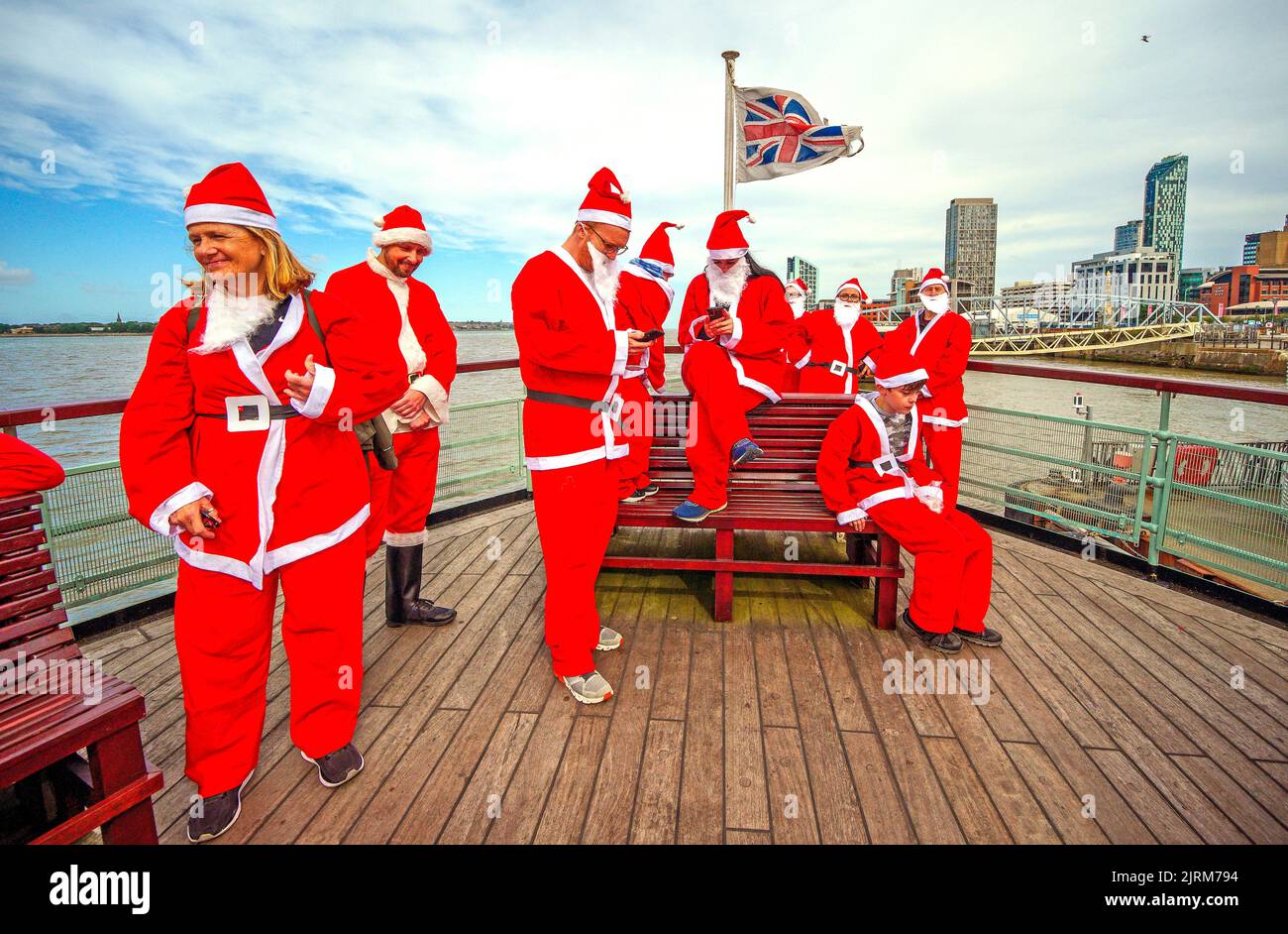 People dressed as Santa Claus on a Mersey Ferry during a photo call for ...