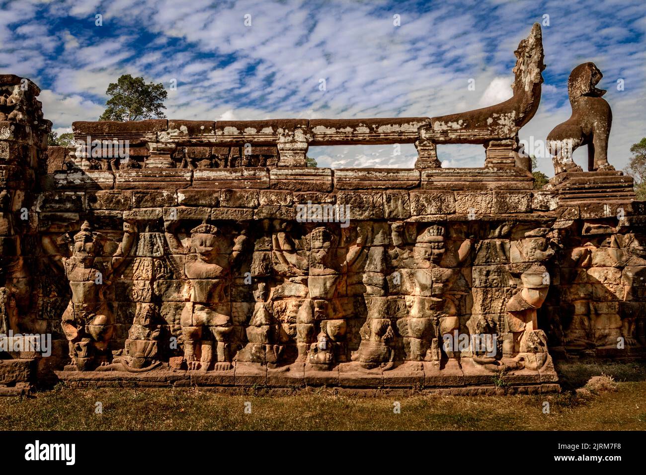 Wall of statues embeded in rock Stock Photo - Alamy