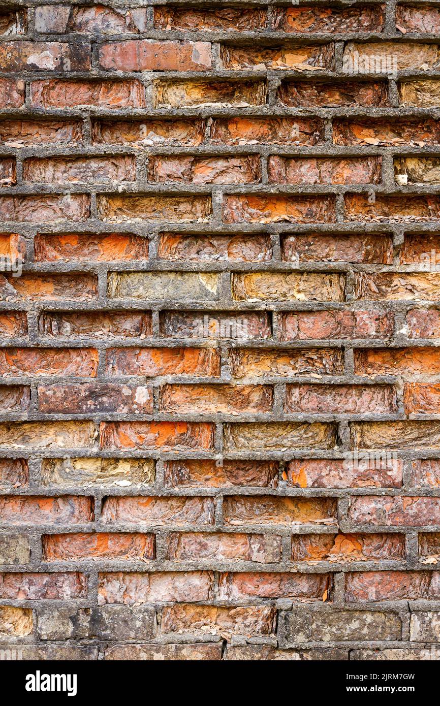 Background of yellow and red brick wall texture Stock Photo - Alamy