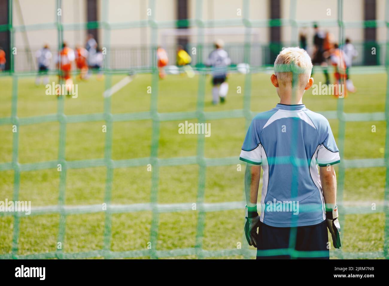 Young Boy Standing in Soccer Goal Wearing Football Goalkeeper Shirt and ...