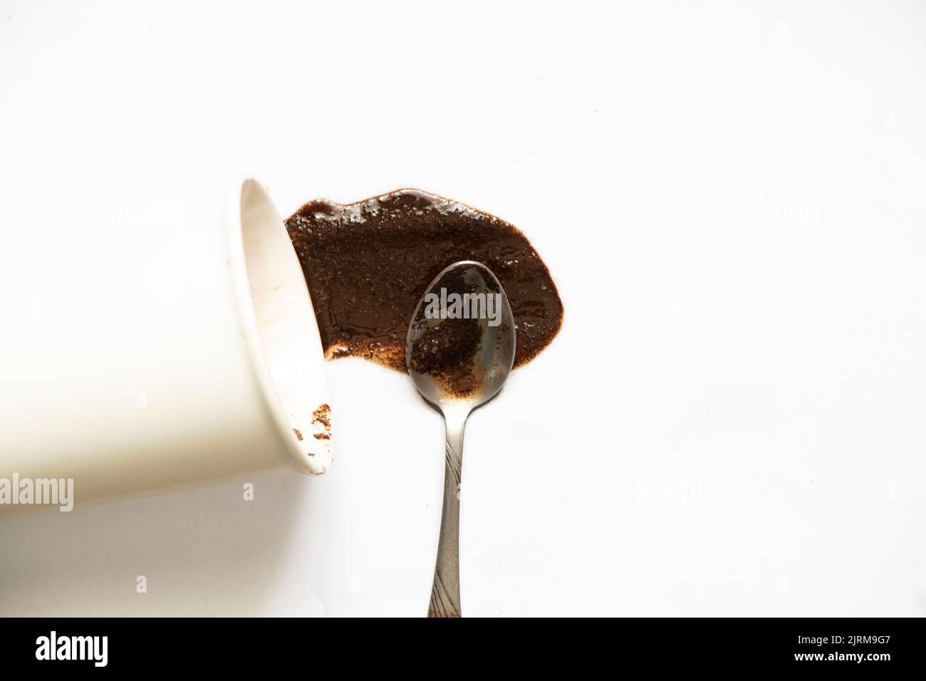 spilled coffee on white background, coffee grounds for background ...