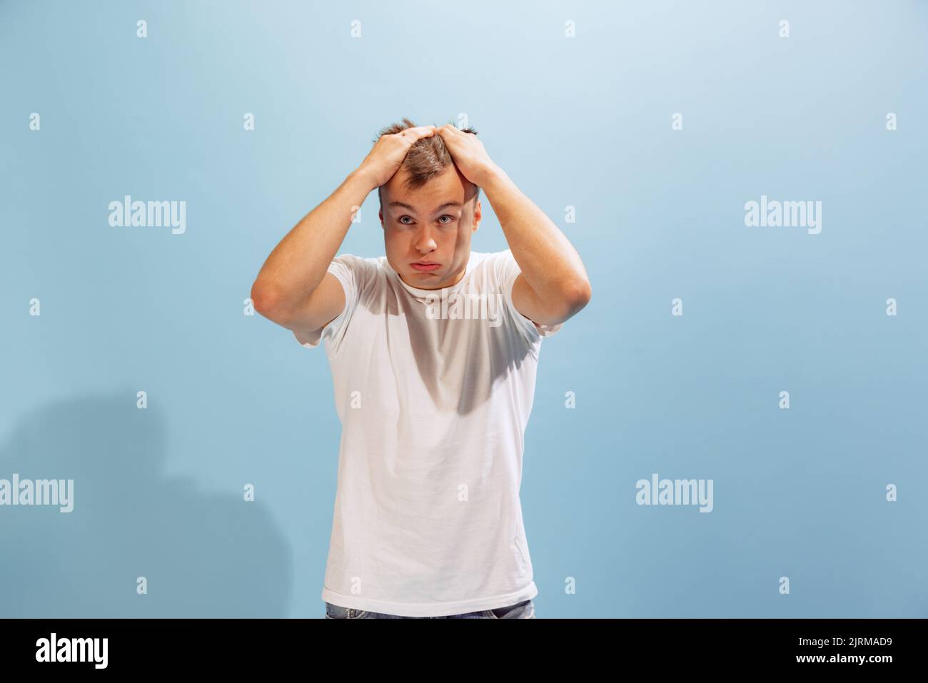 Portrait of young emotive man showing expression of stress, feeling ...