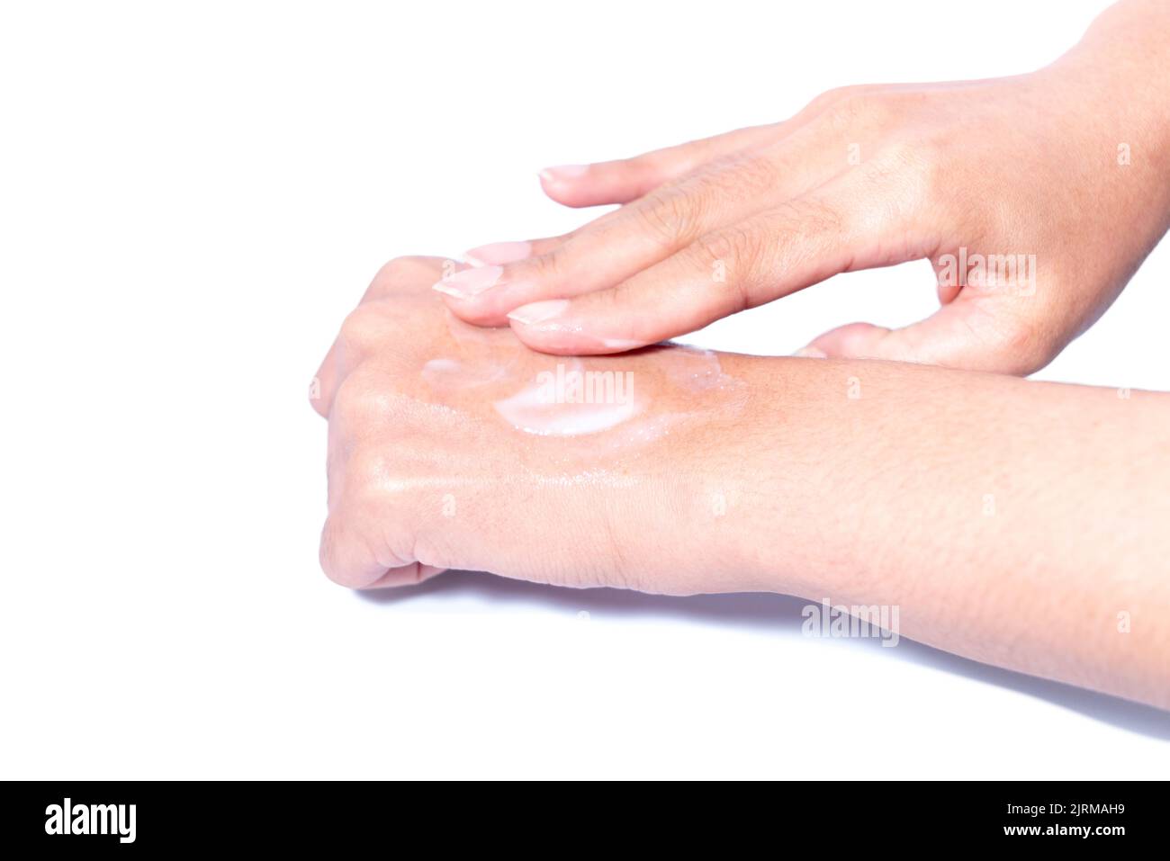 Closeup woman applying protective cream on hands. Cold season and dry ...