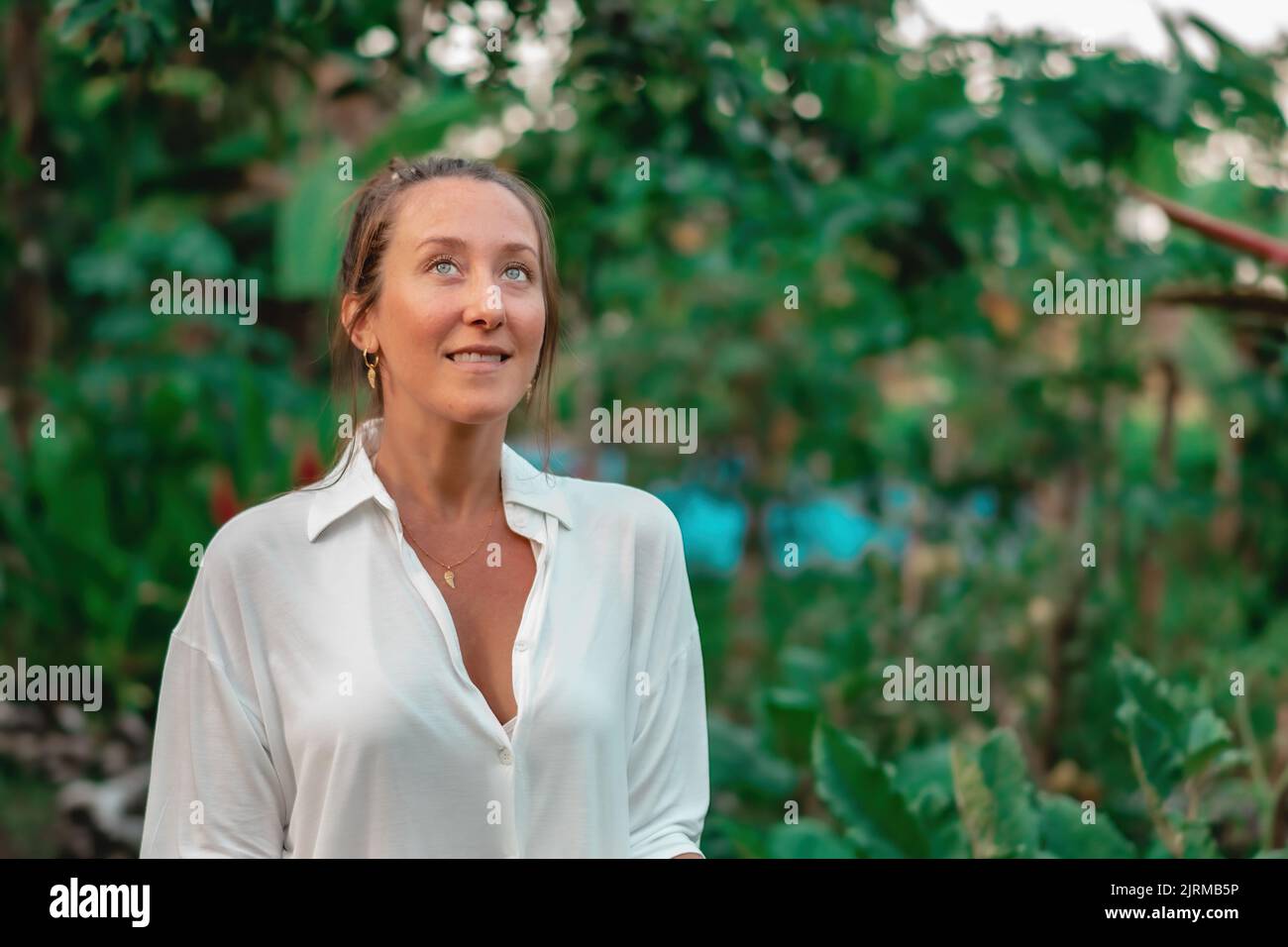 A female immersing in nature in her home garden Stock Photo - Alamy