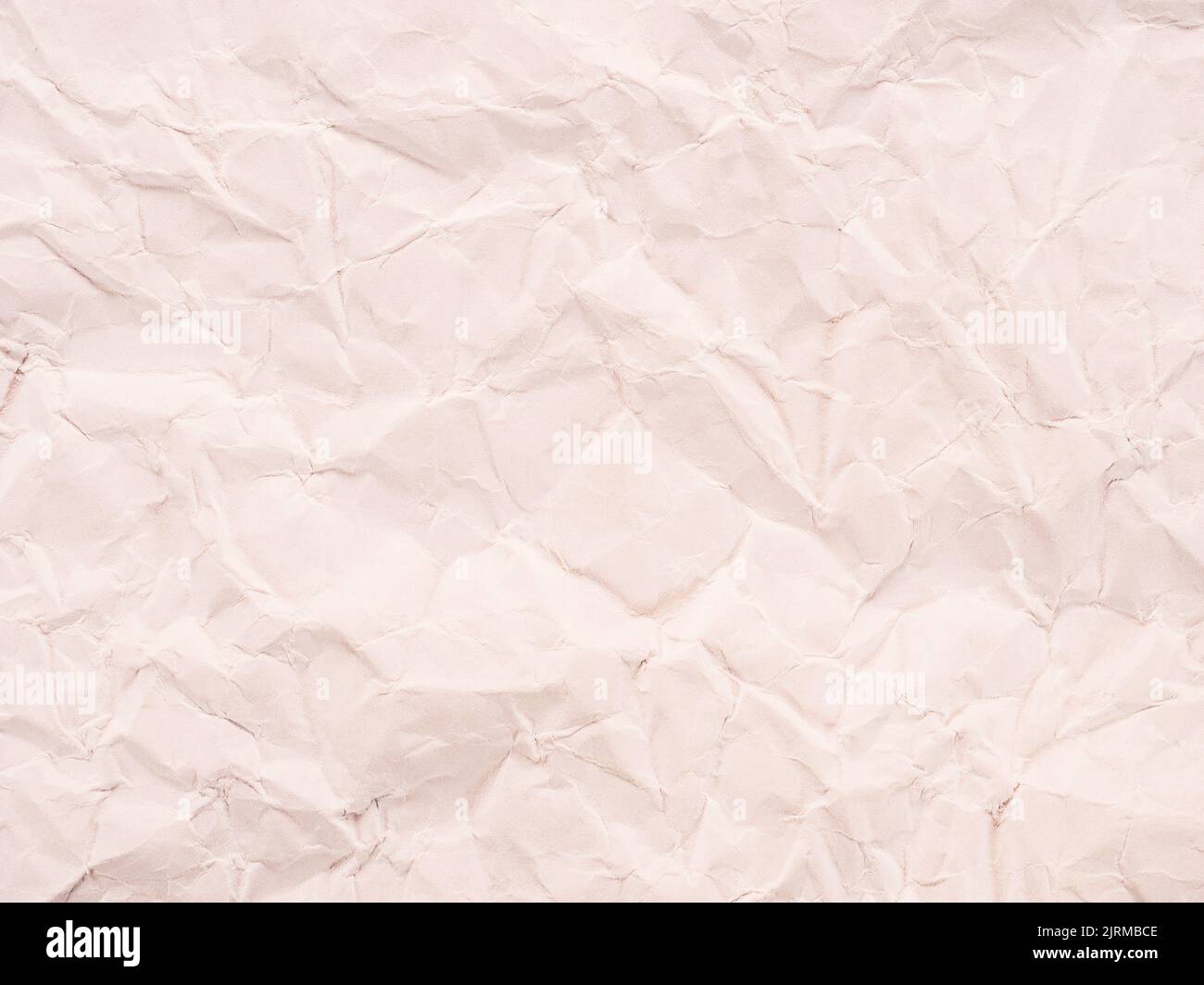 Crumpled paper texture as an abstract background with warm tint Stock ...