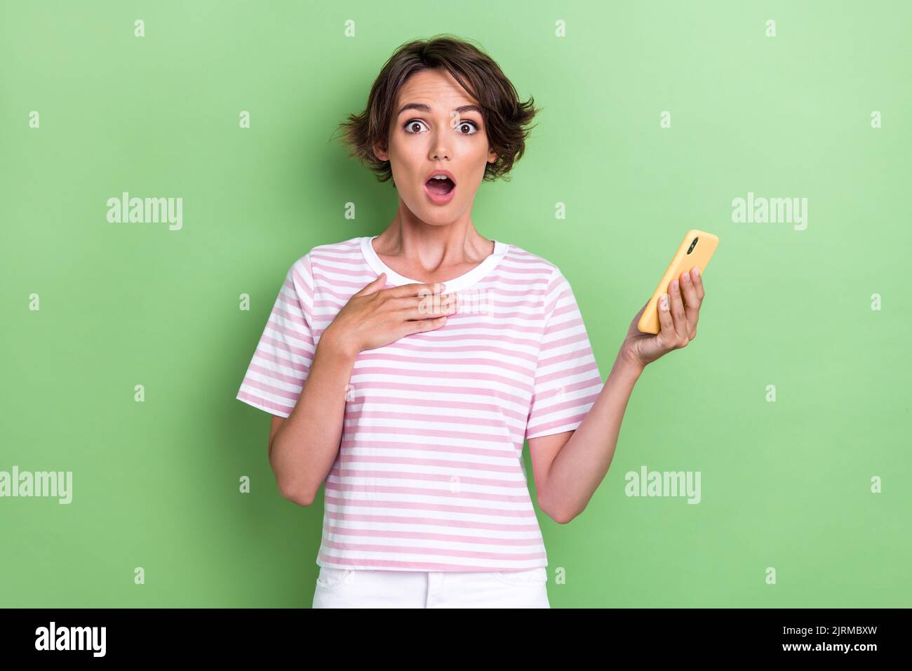 Photo of young attractive gorgeous pretty woman hold hand chest phone ...