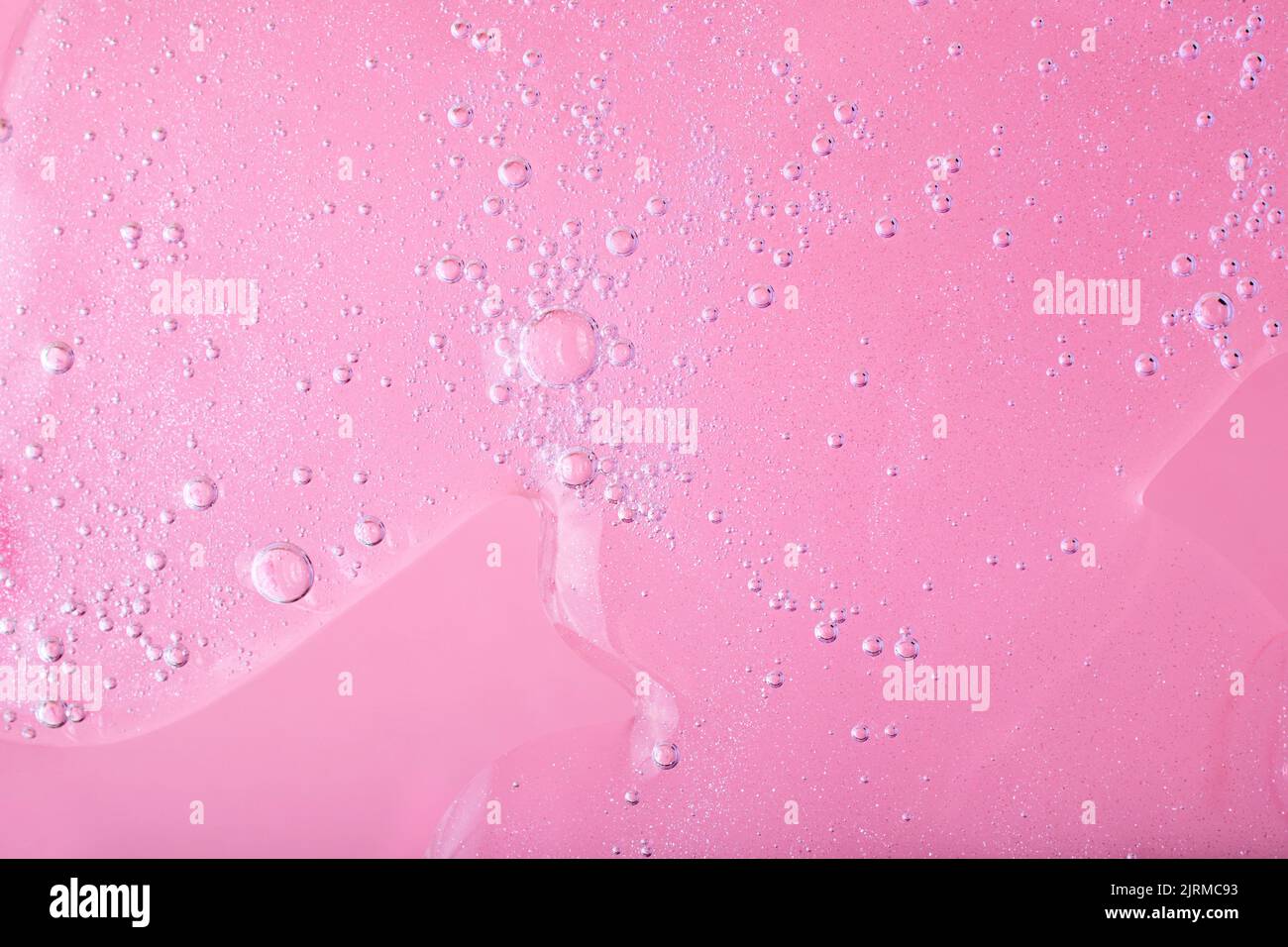 Macro photography of bubbly smear on raspberry pink background Stock ...
