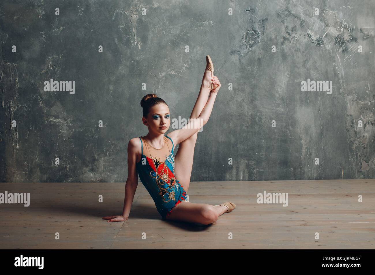 Young girl professional gymnast woman dance rhythmic gymnastics at ...