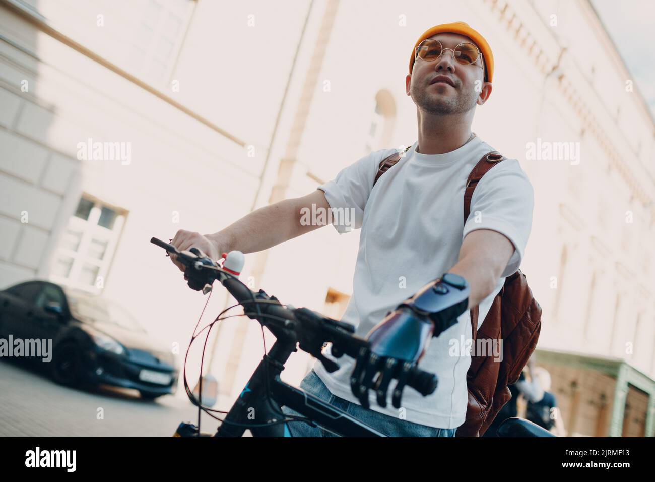 Young disabled man with artificial prosthetic hand in casual clothes ...