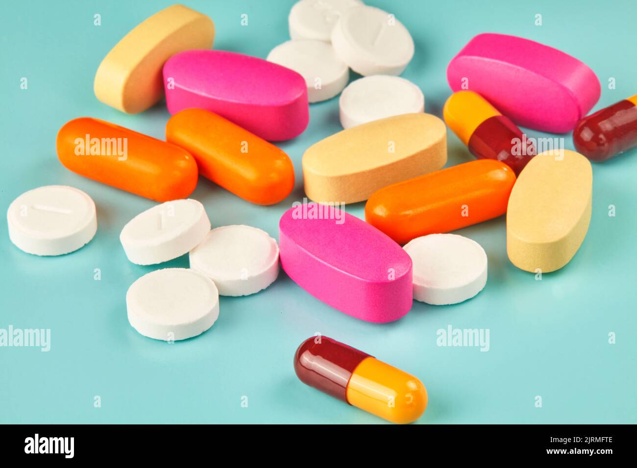 A pile of scattered colorful medicines Stock Photo - Alamy