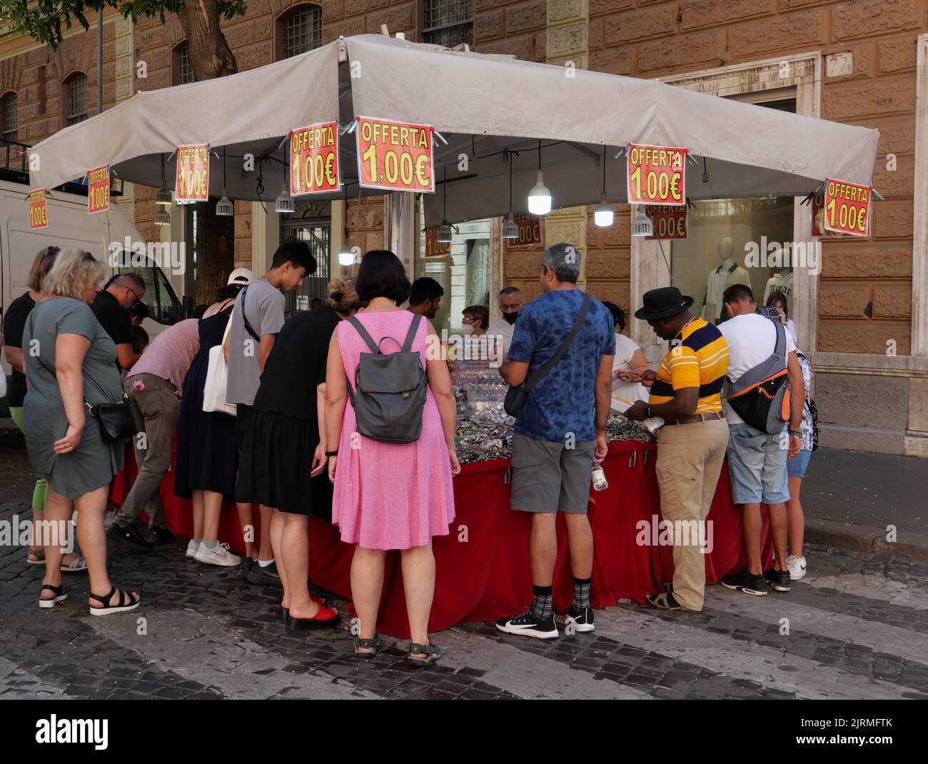 PEOPLE AROUND A STALL WHERE EVERYTHING IS SOLD FOR ONE EURO Stock Photo ...