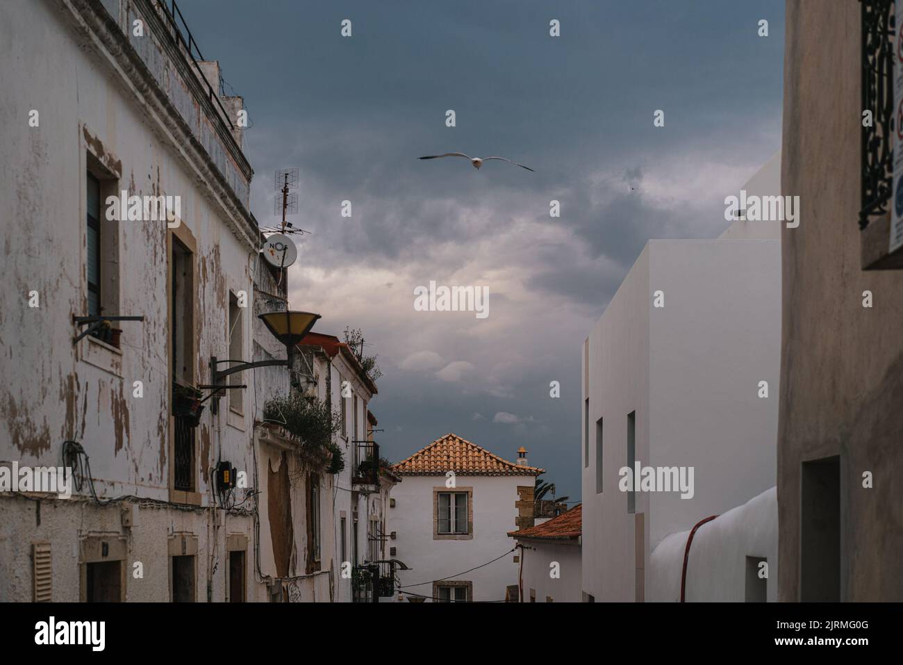 A beautiful shot of the streets in Lagos, Portugal during the sunset ...