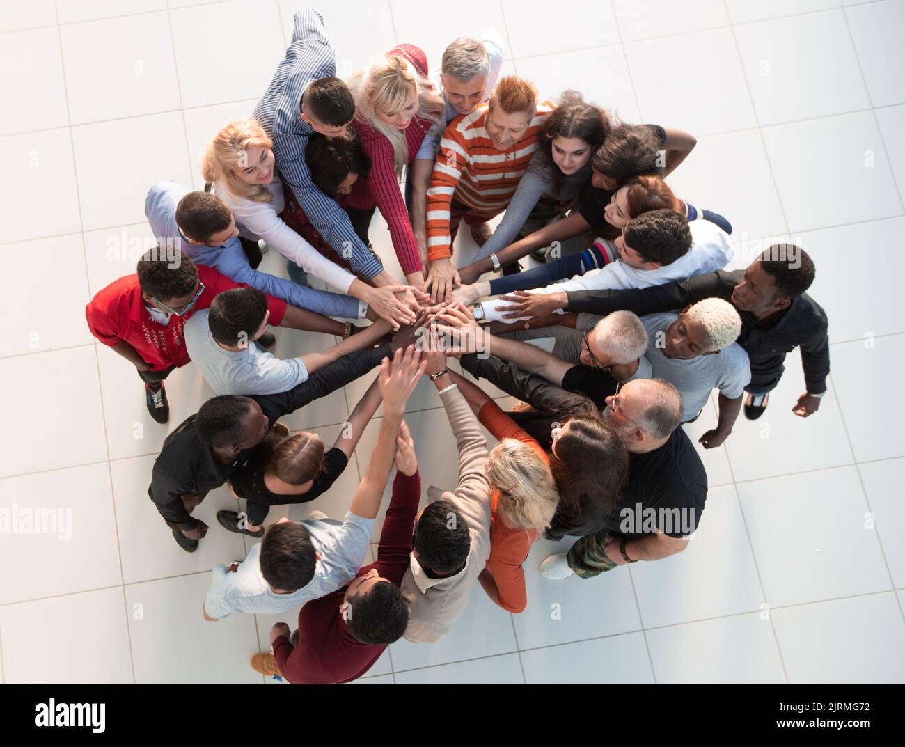 Group of people with hands together - teamwork concepts Stock Photo - Alamy