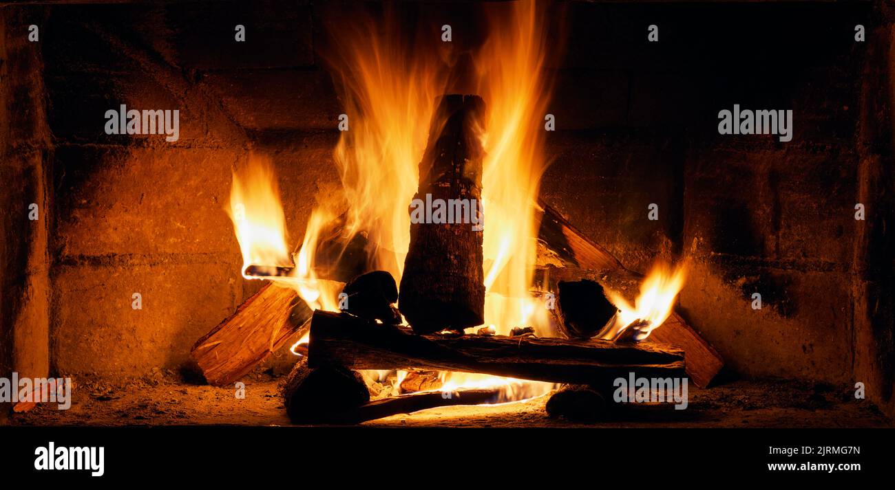The close-up view of firewood burning in the flames of the fire Stock ...