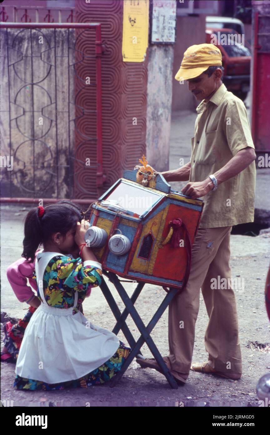 Old man operating the bioscope unit hi-res stock photography and images ...