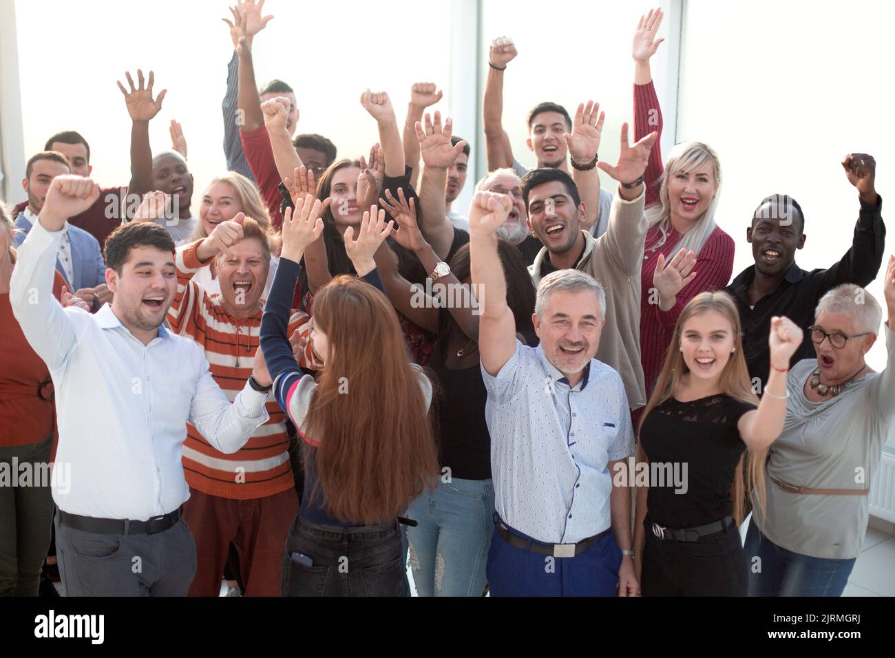 Business team raising their hands up to celebrate victory Stock Photo ...