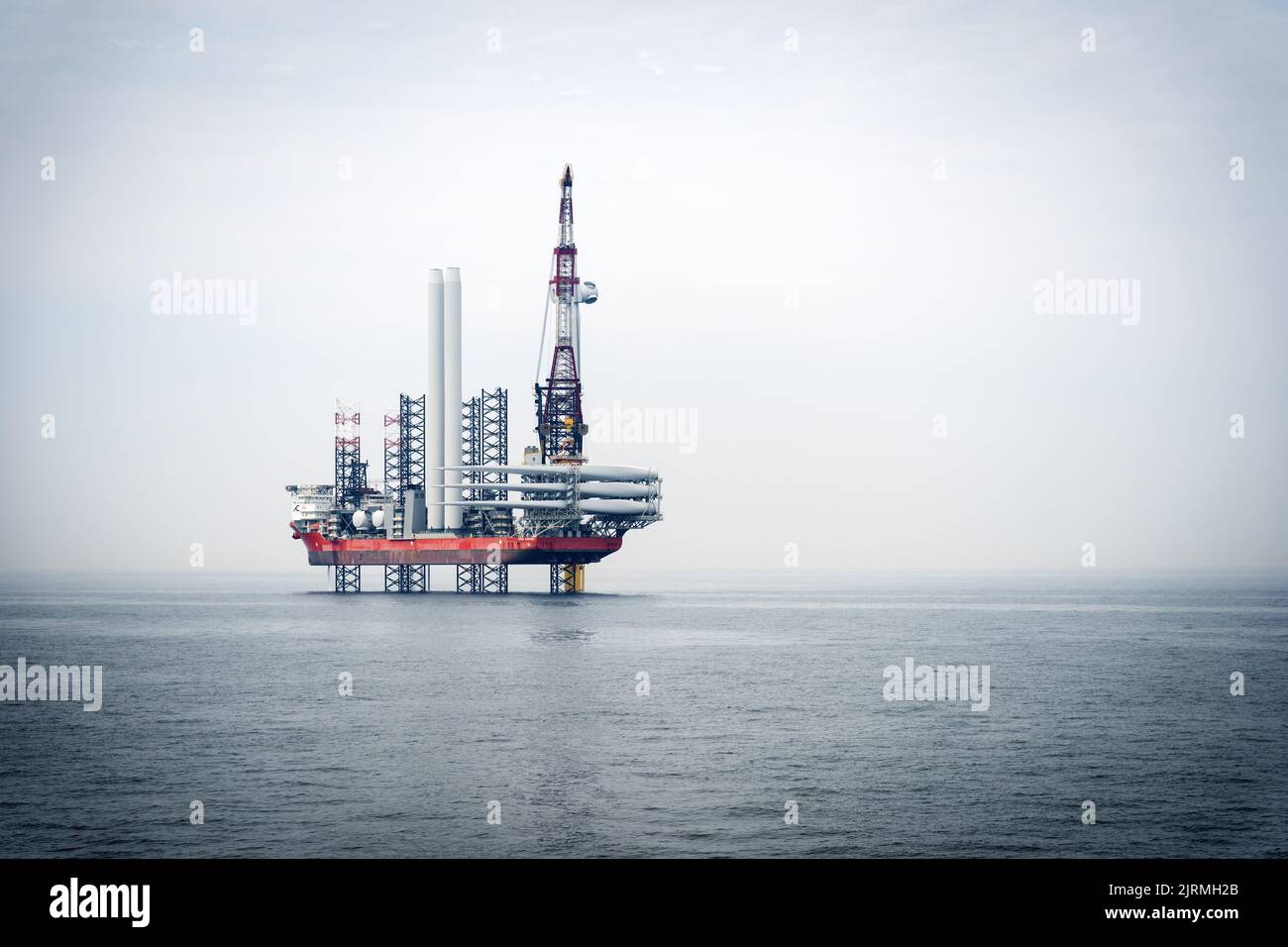 2022-08-25 13:39:45 SCHEVENINGEN - A work ship is building a windmill ...