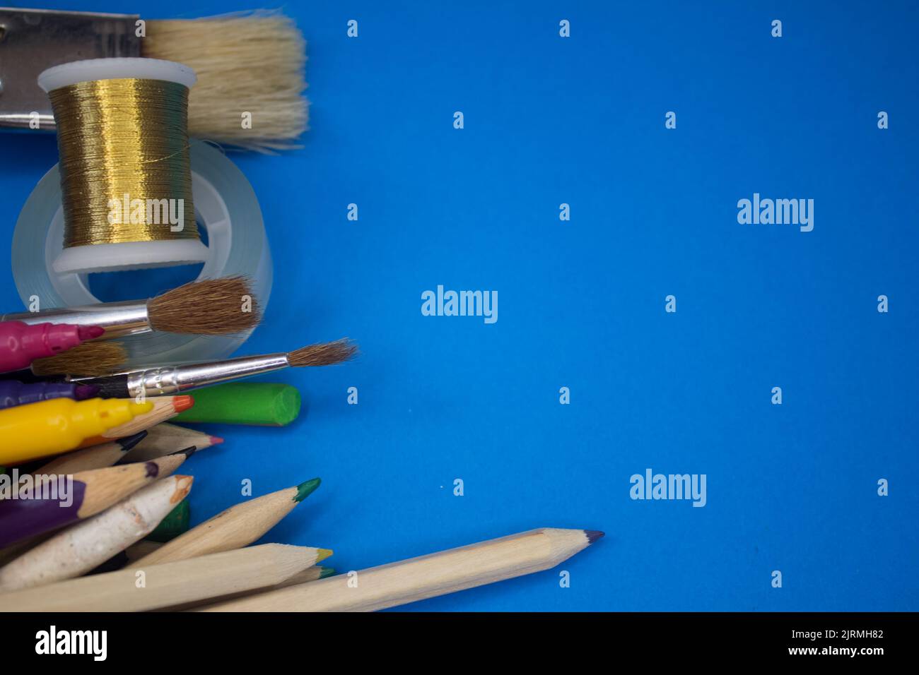 Overhead shot of school supplies, brushes, pencils, artistic tools. Art ...