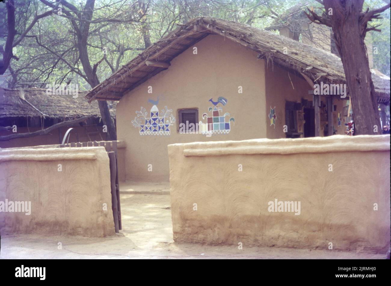 Paintings on the walls of traditional rural house in India Stock Photo ...