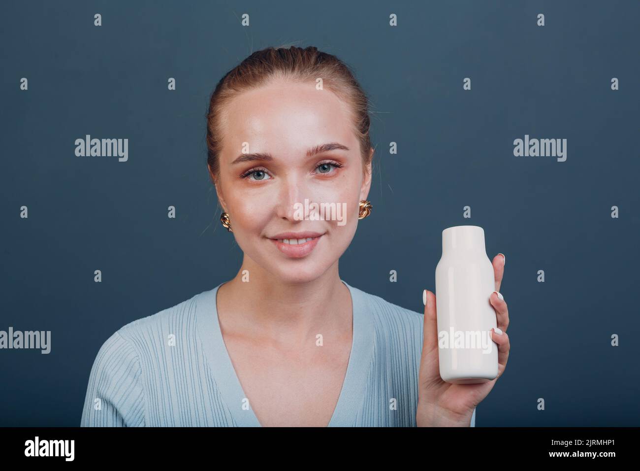 Pretty young woman hold white bottle template blank empty space ... Pretty young woman hold white bottle template blank empty space ...